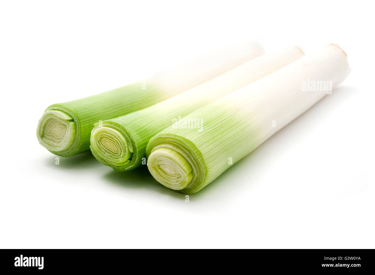 Leek stems on a white background Stock Photo - Alamy