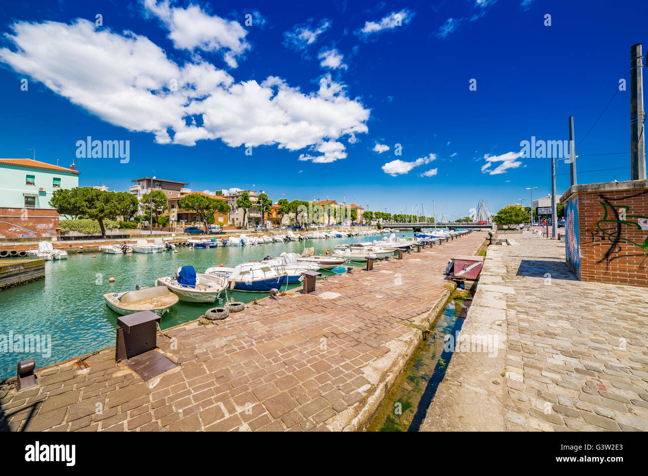 Scenic spring view of pier with ancient and modern buildings, ships ...