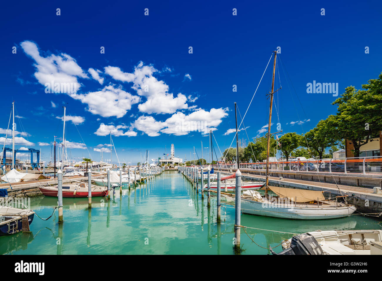 Scenic spring view of pier with ancient and modern buildings, ships ...