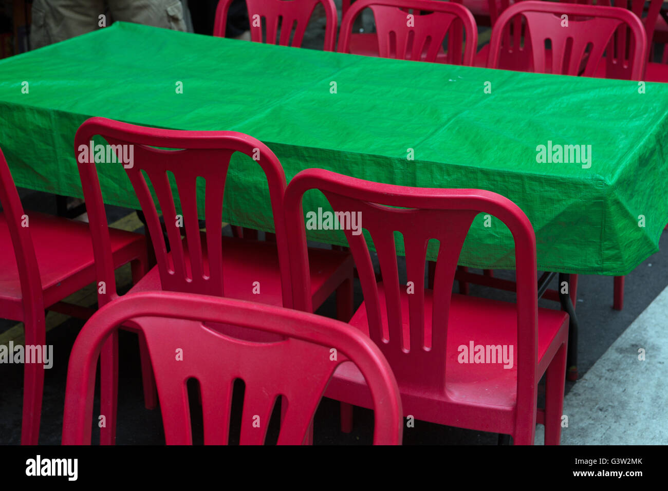 Red chair green table Stock Photo - Alamy