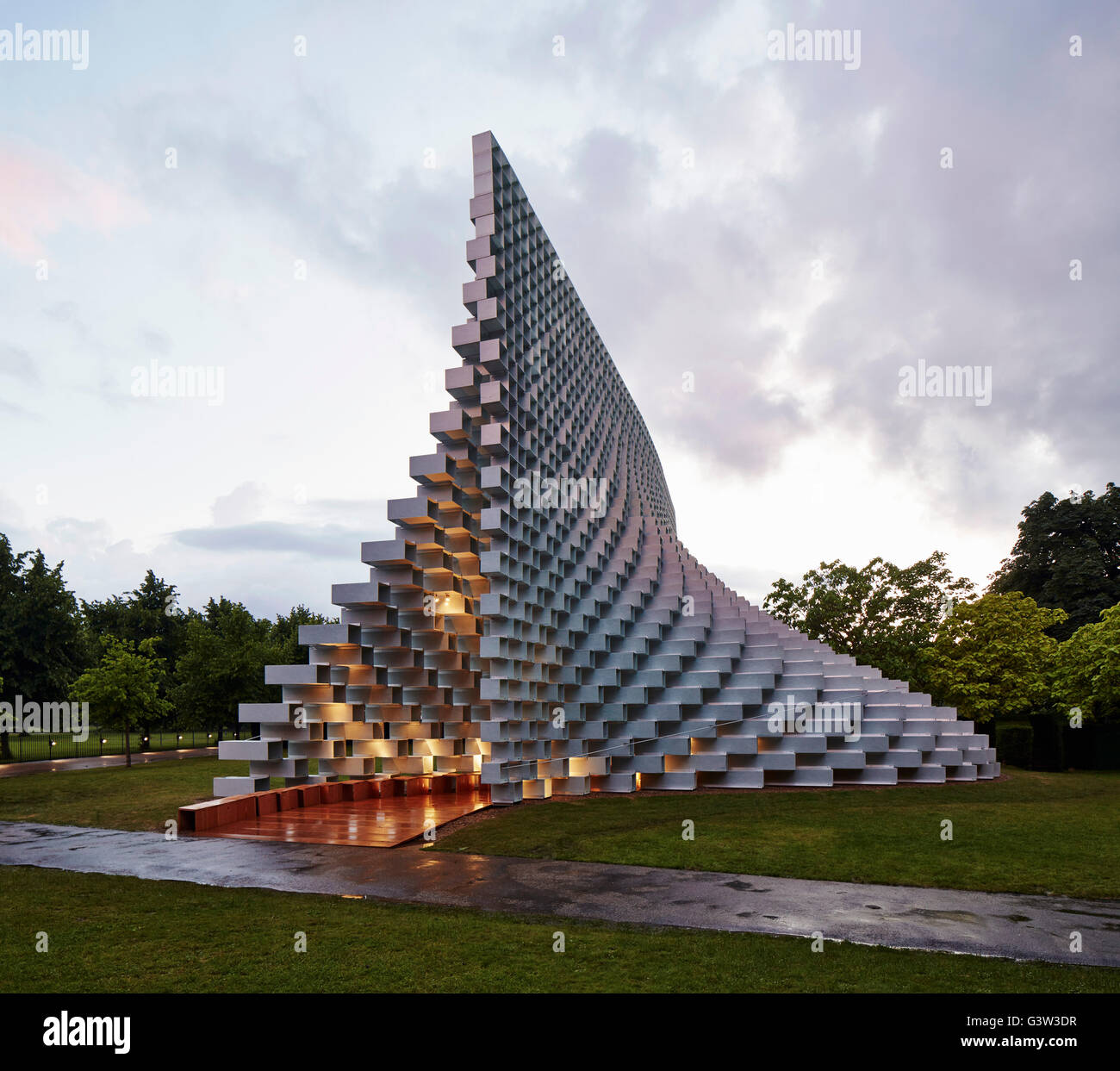 Elevation of undulating sculptural pavilion at dusk, oblique elevation ...
