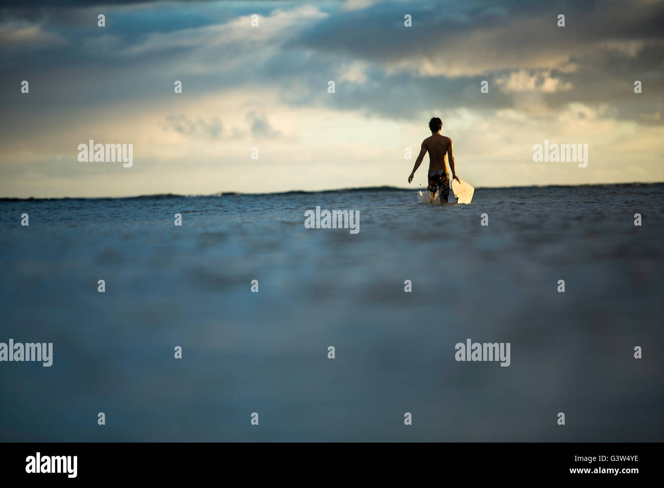Surfer crossing sandbar at Ala Moana Beach Park, Honolulu, Hawaii Stock ...