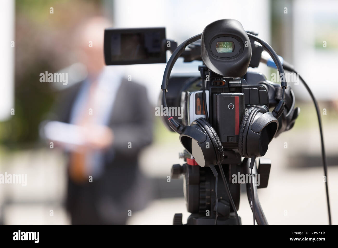 Filming an event with a video camera Stock Photo - Alamy