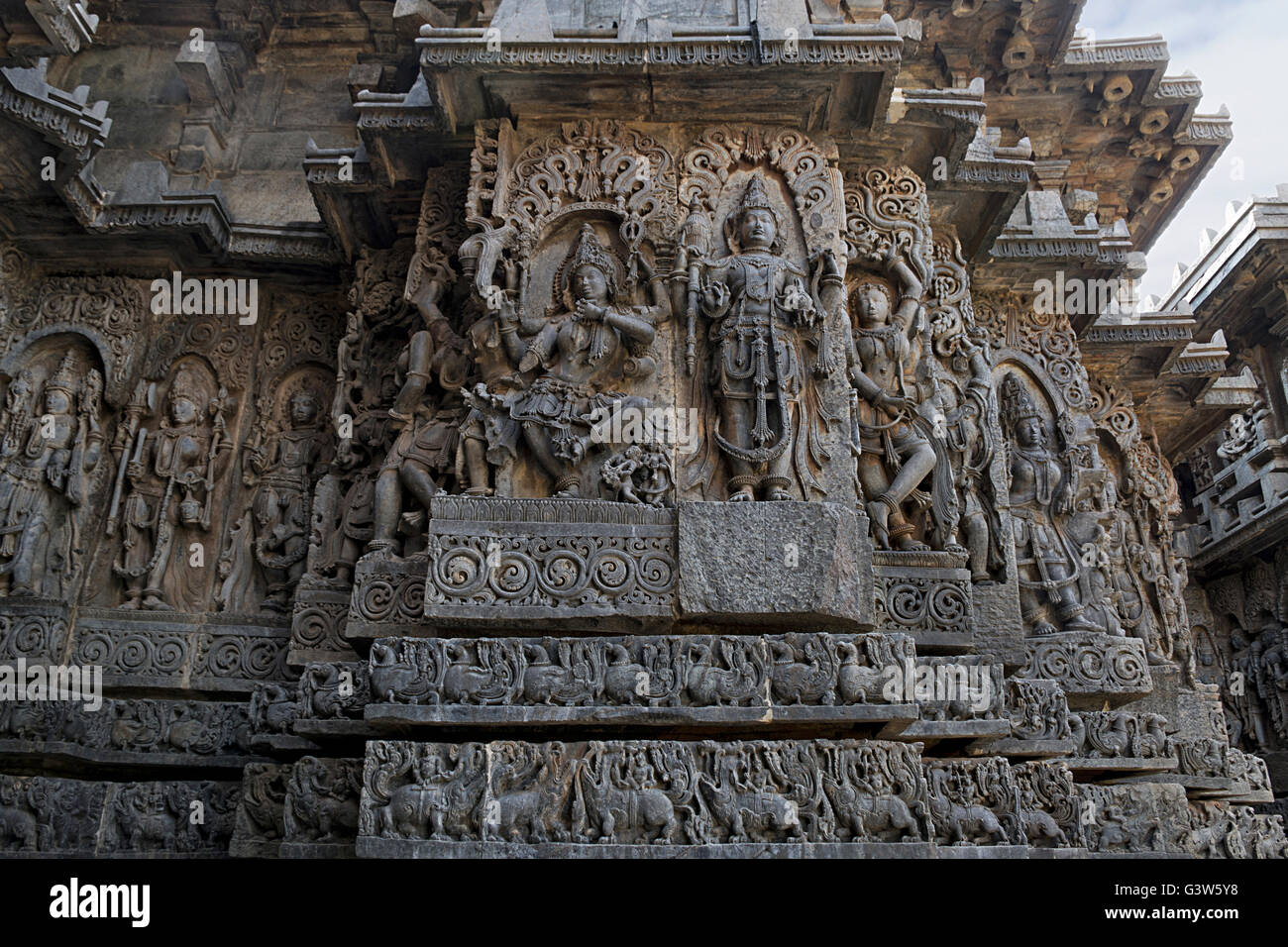 Sculpture of dancing Shiva on the center left and Vishnu on the right ...