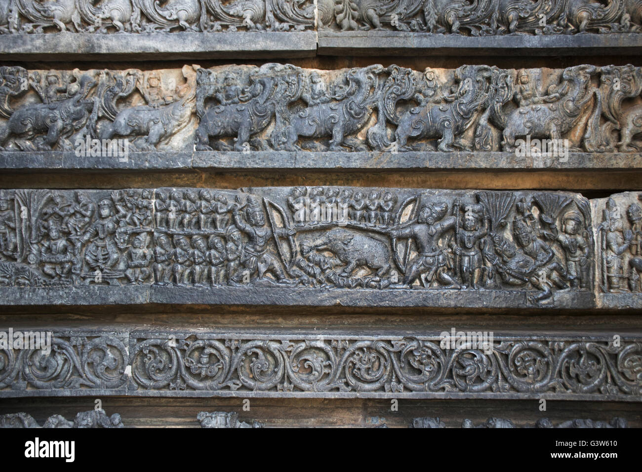 Depiction of Arjuna-Kirata (Shiva) hunting the pig, at the base of ...