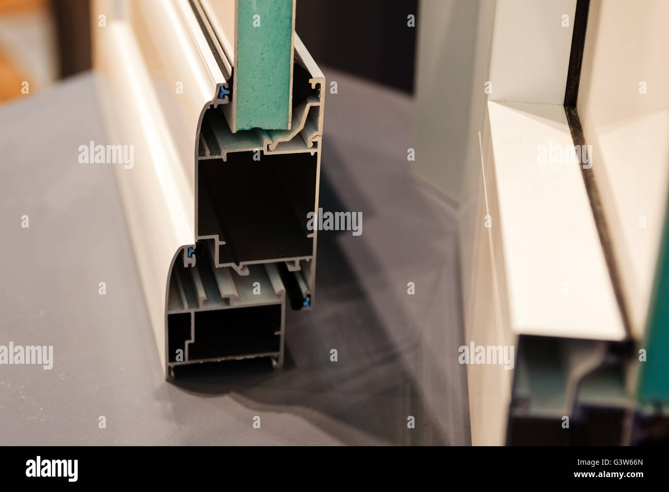 Cut of the window profile with metal, glass and insulation Stock Photo ...