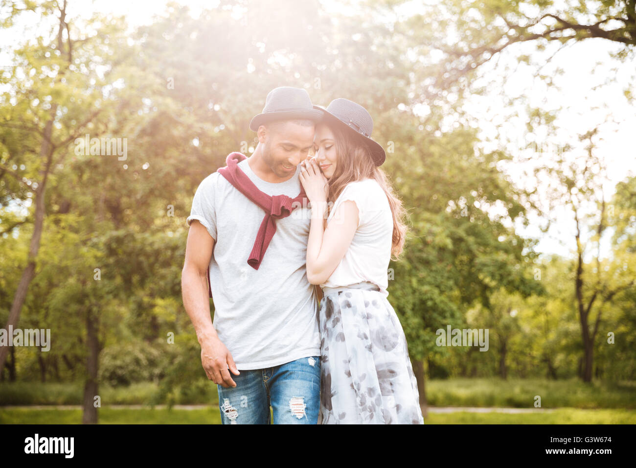 Sensual beautiful young couple waking in summer park Stock Photo - Alamy