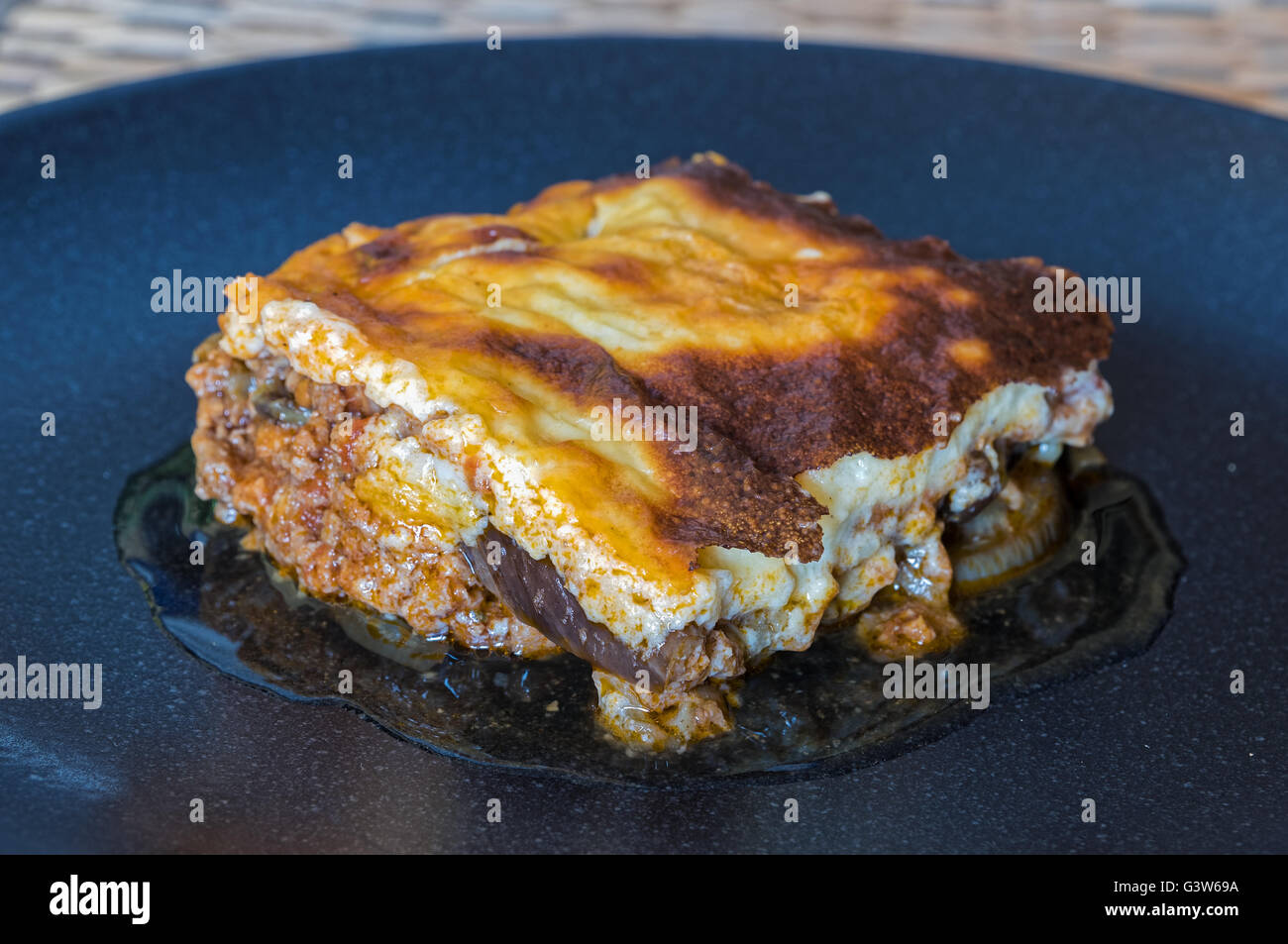 Plate of homemade moussaka on table Stock Photo - Alamy