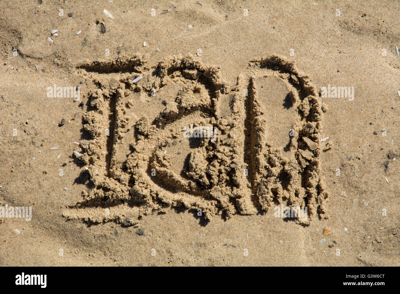 Writing name in sand hi-res stock photography and images - Alamy