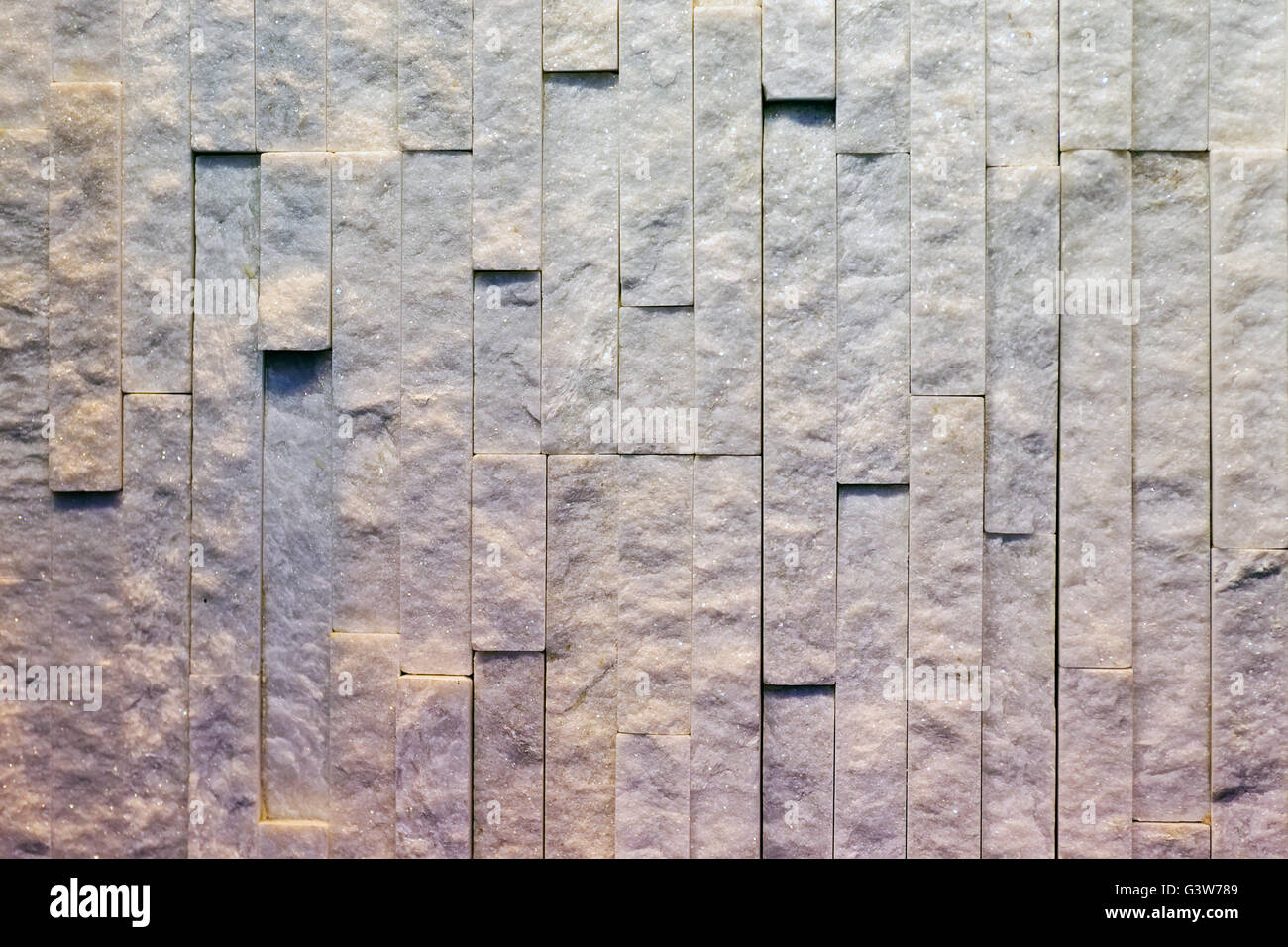 Detail of modern room with stone wall Stock Photo - Alamy