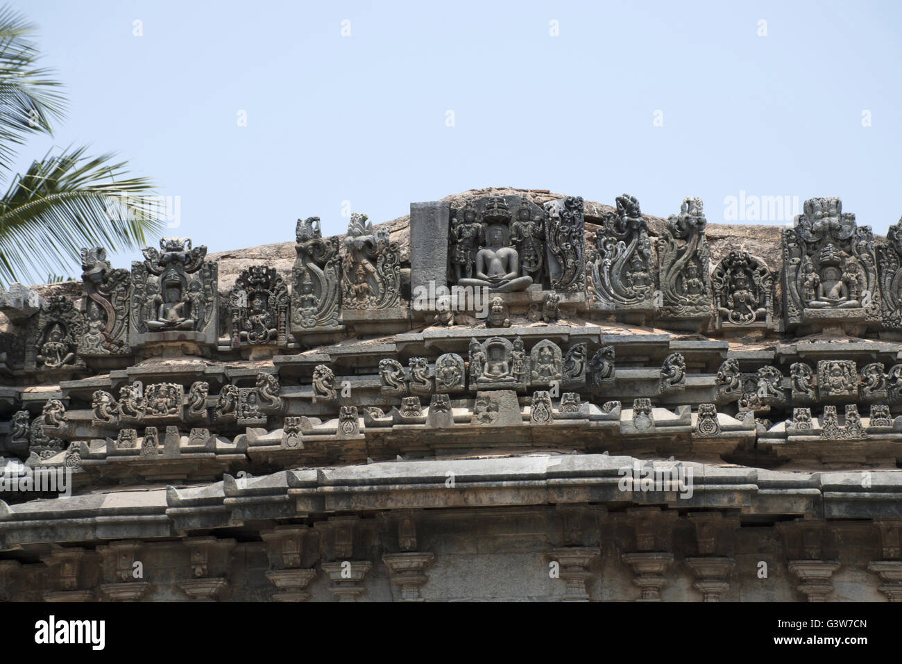 A panel sculpture showing the Jain tirthankara with Yaksha ...