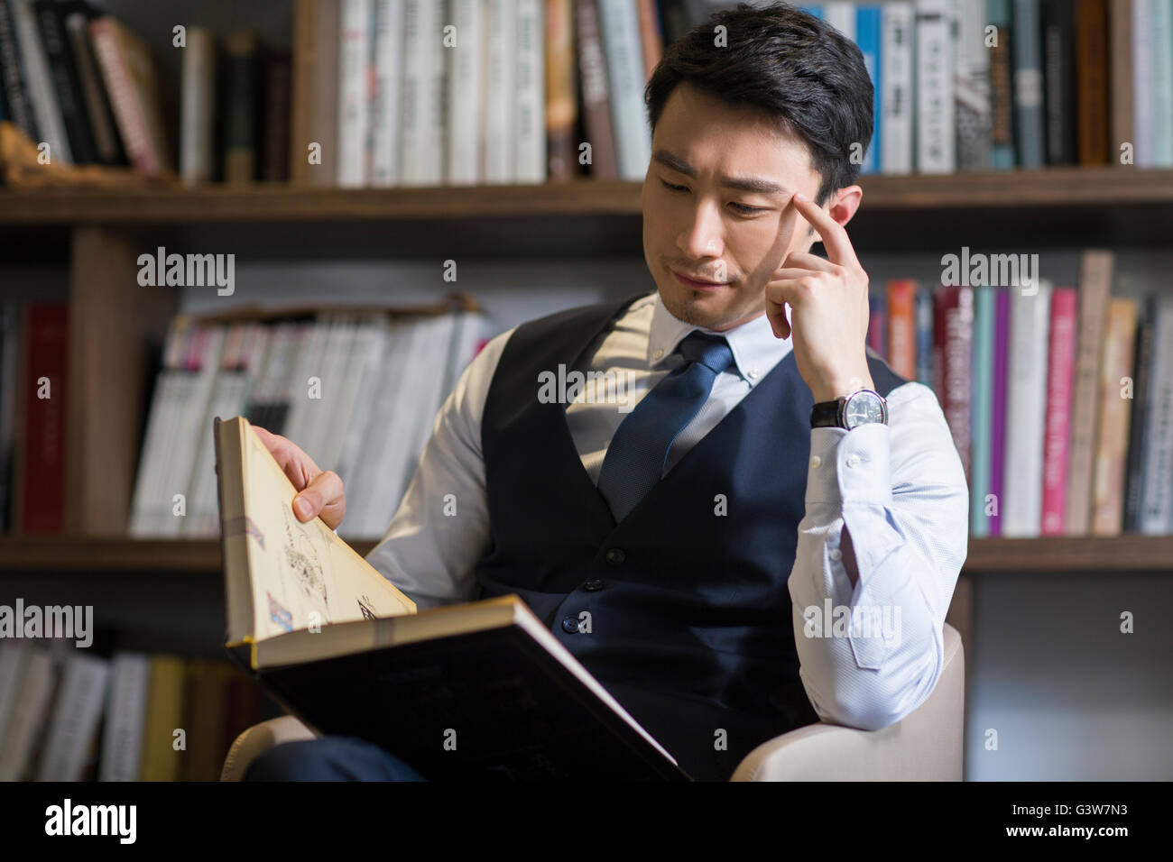 Gold on book and person reading hi-res stock photography and images - Alamy