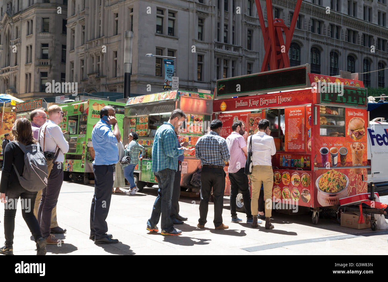 Business men on lunch break queuing in line for Indian food from a ...