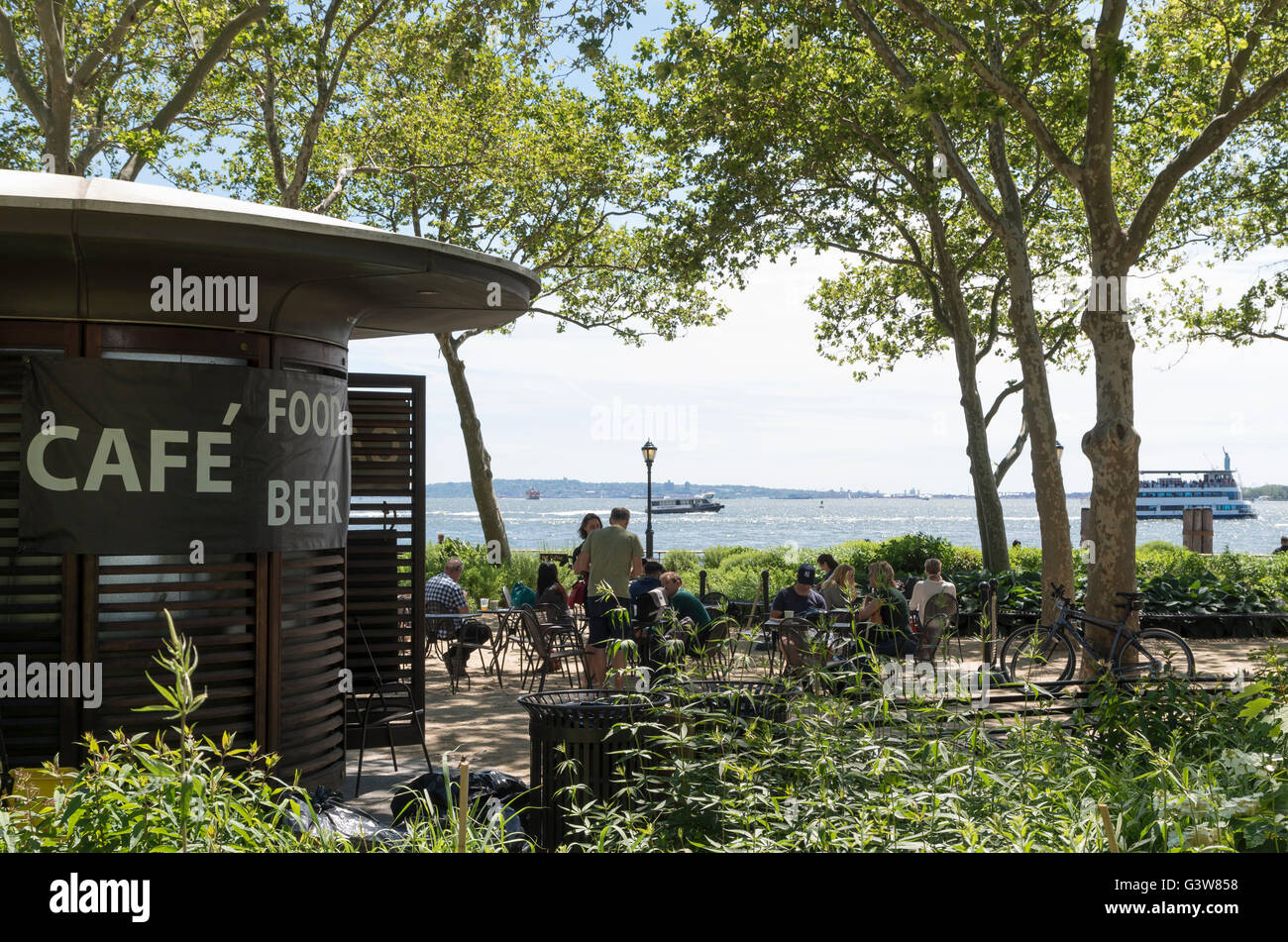 Table Green Cafe, Battery Park, in Summer with people eating and ...
