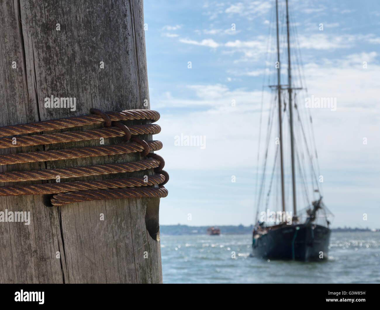 Wooden pillar wound with rope with tour clipper tall ship "Clipper City ...