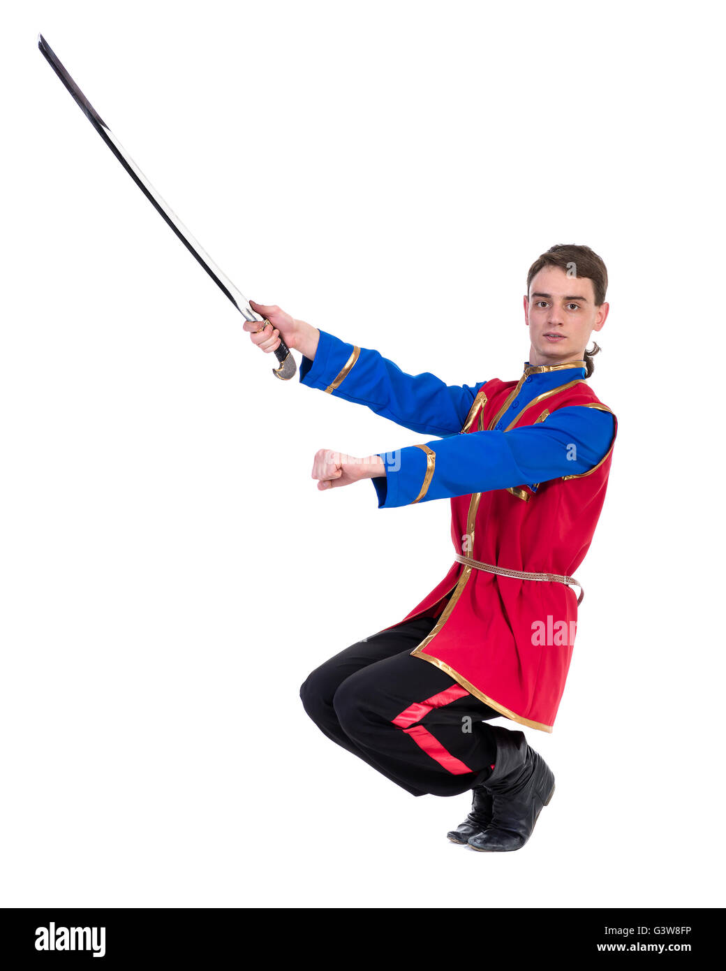 Russian cossack dance. Young dancer posing with sword Stock Photo - Alamy