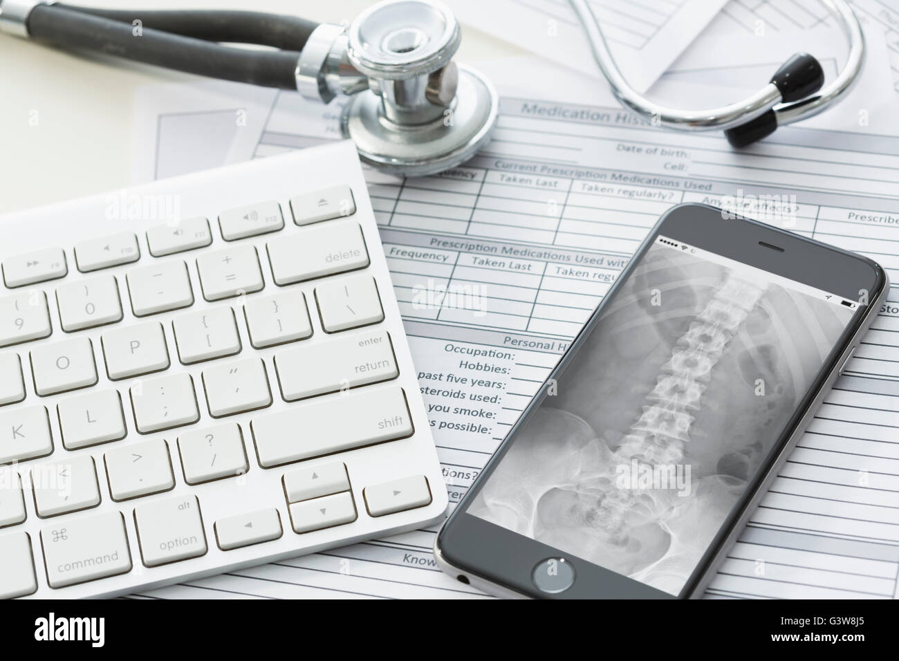 Stethoscope, keyboard and smartphone on medical record Stock Photo - Alamy
