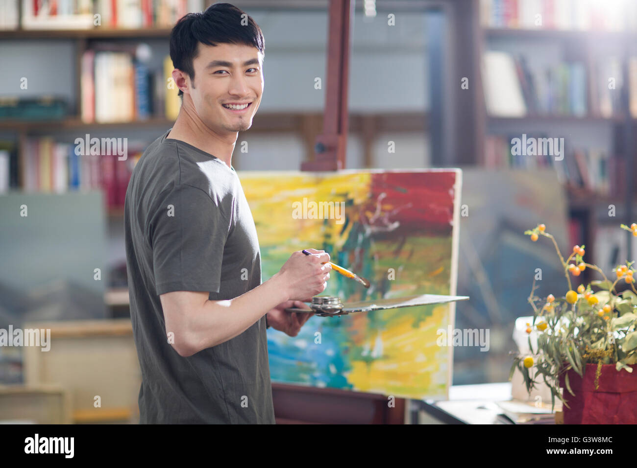 Artist painting in his studio Stock Photo - Alamy