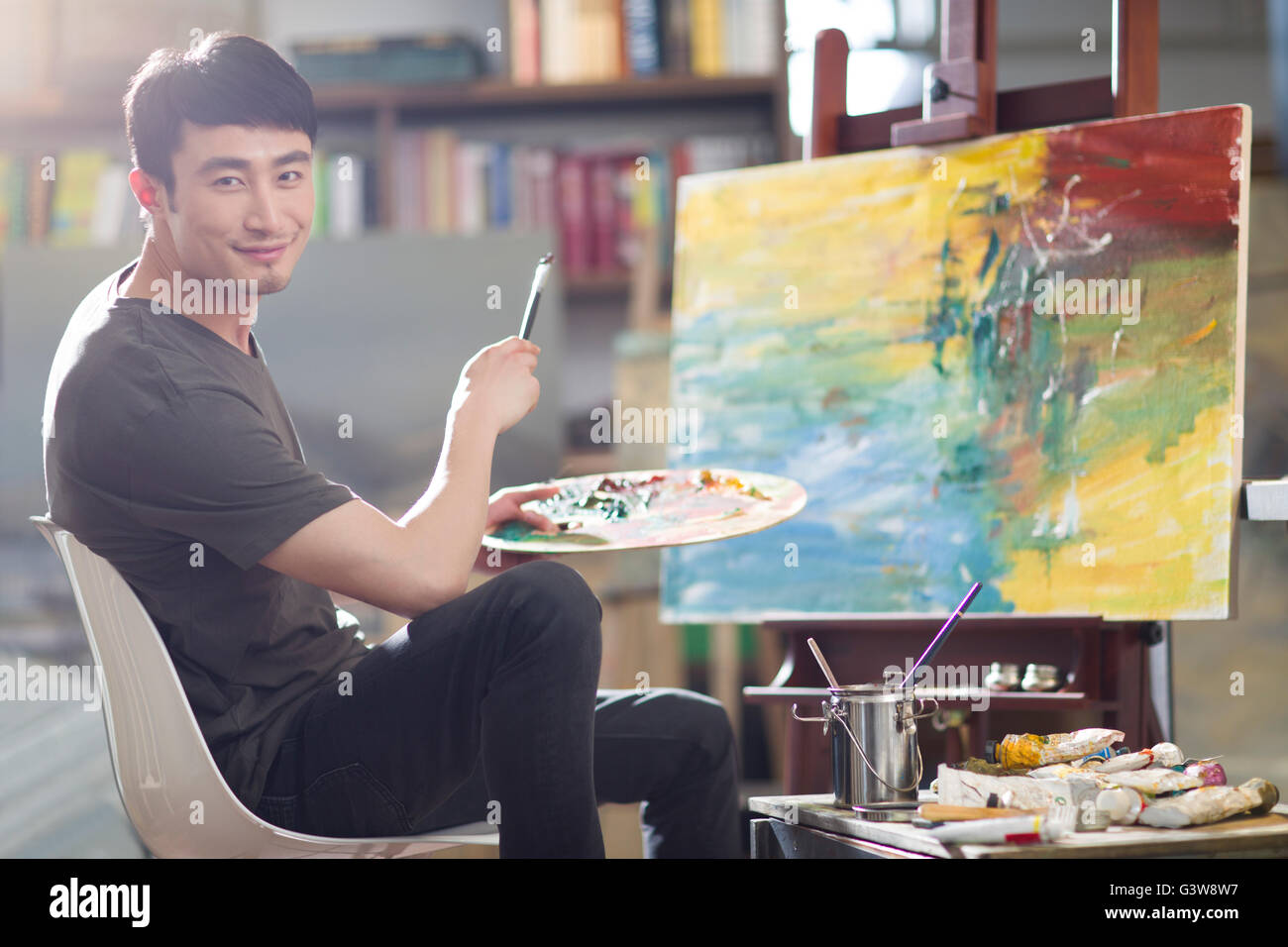 Artist painting in his studio Stock Photo - Alamy