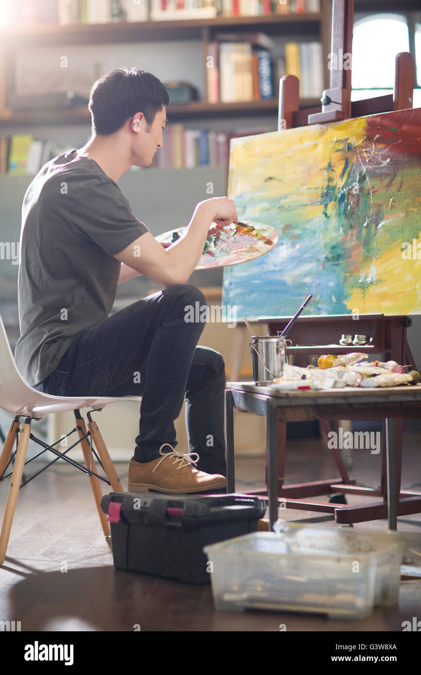 Artist painting in his studio Stock Photo - Alamy