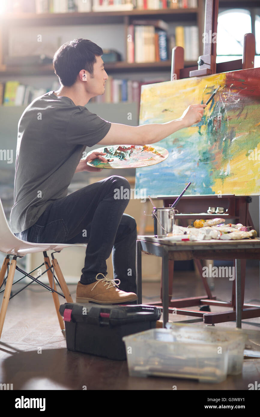 Artist painting in his studio Stock Photo - Alamy