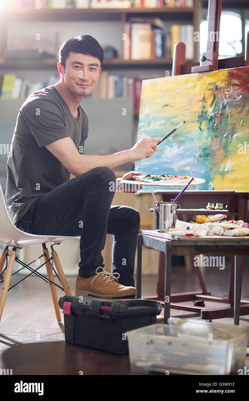Artist painting in his studio Stock Photo - Alamy