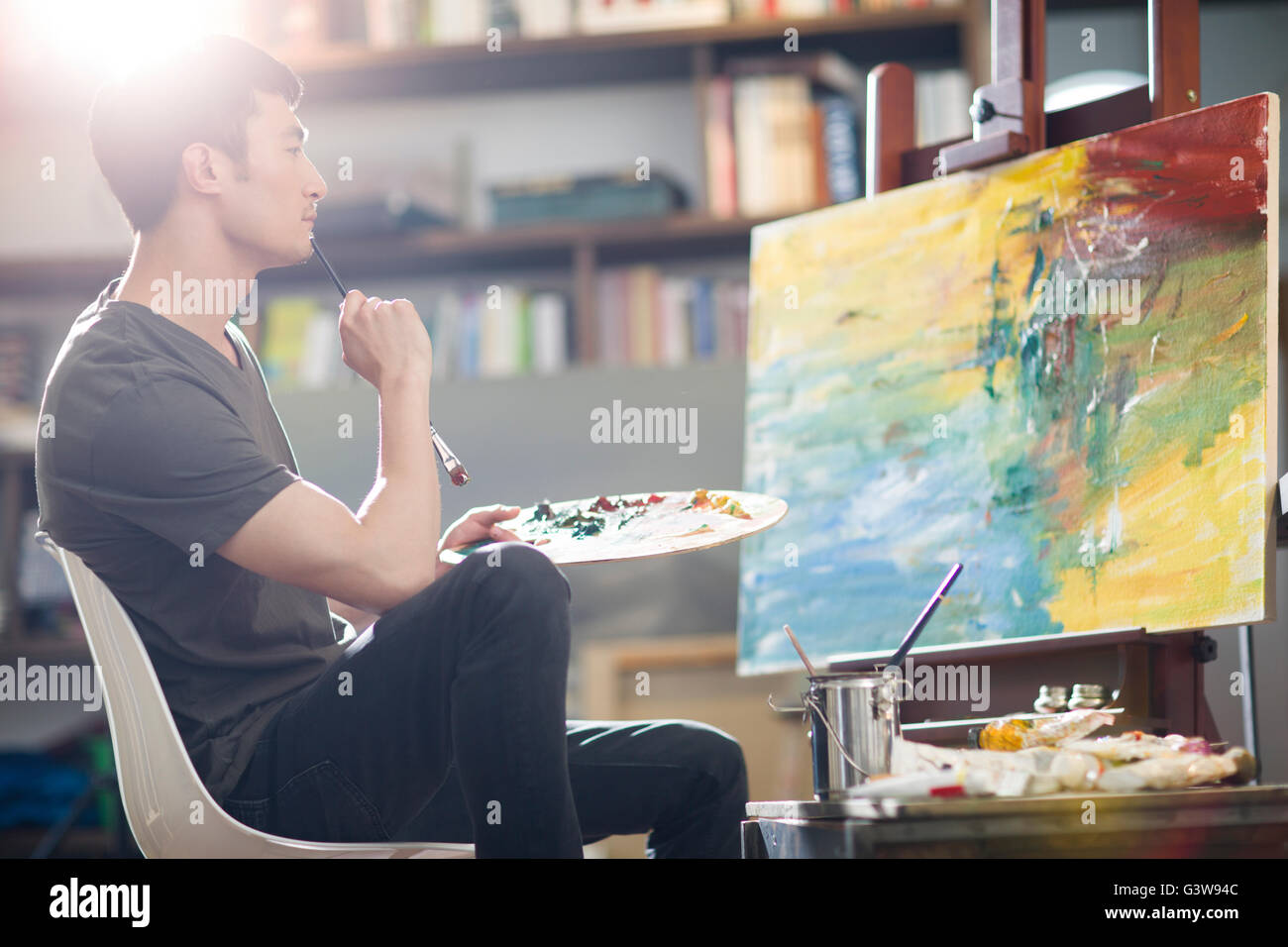 Artist painting in his studio Stock Photo - Alamy