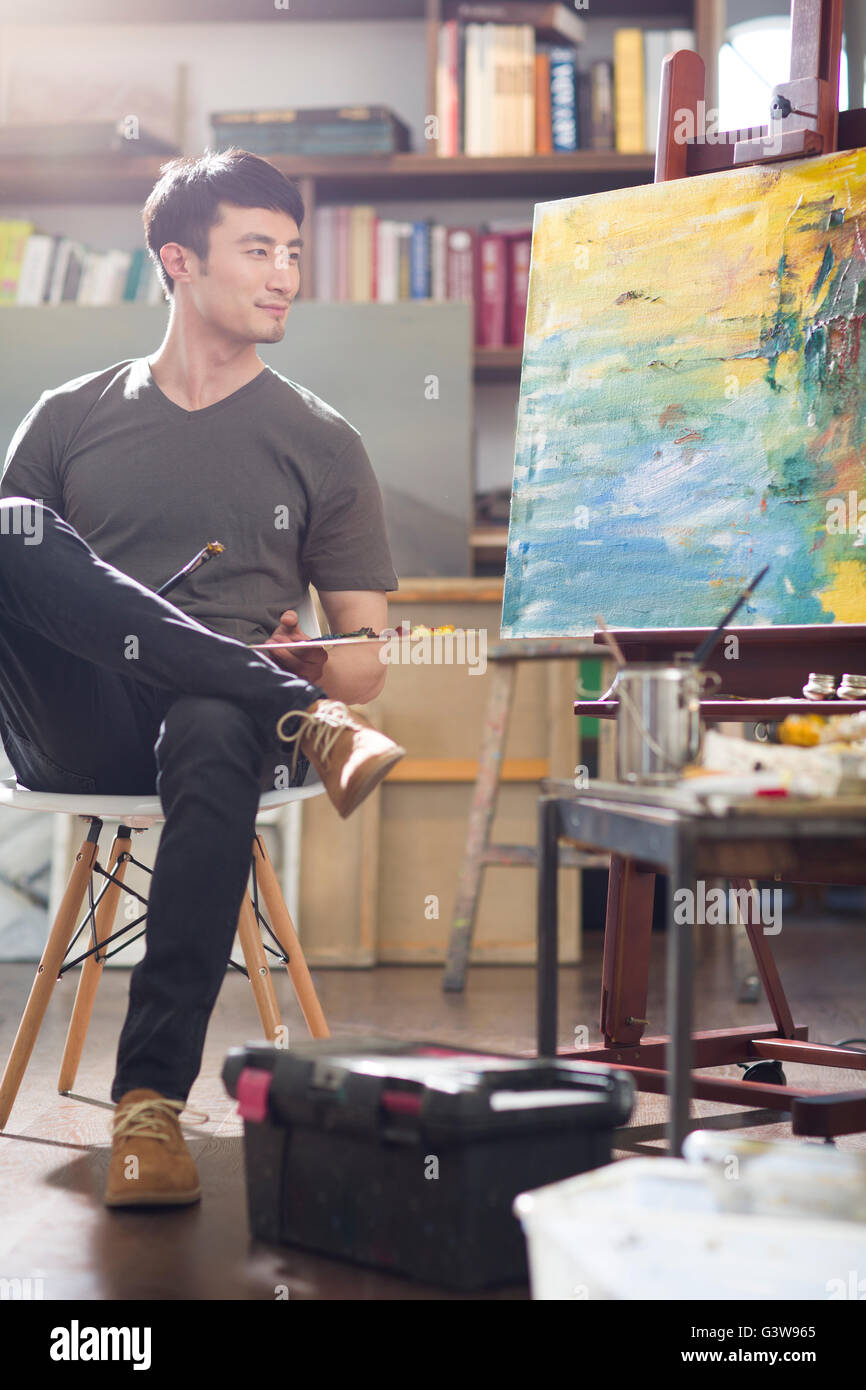 Artist painting in his studio Stock Photo - Alamy