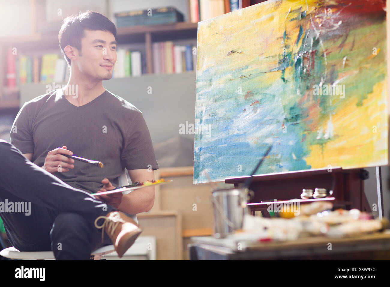Artist painting in his studio Stock Photo - Alamy