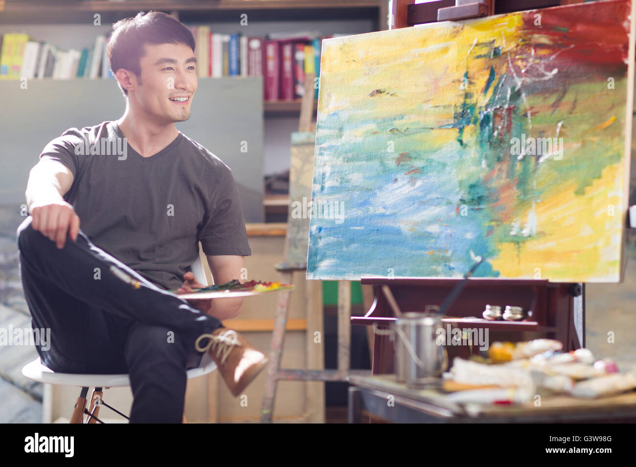 Artist painting in his studio Stock Photo - Alamy