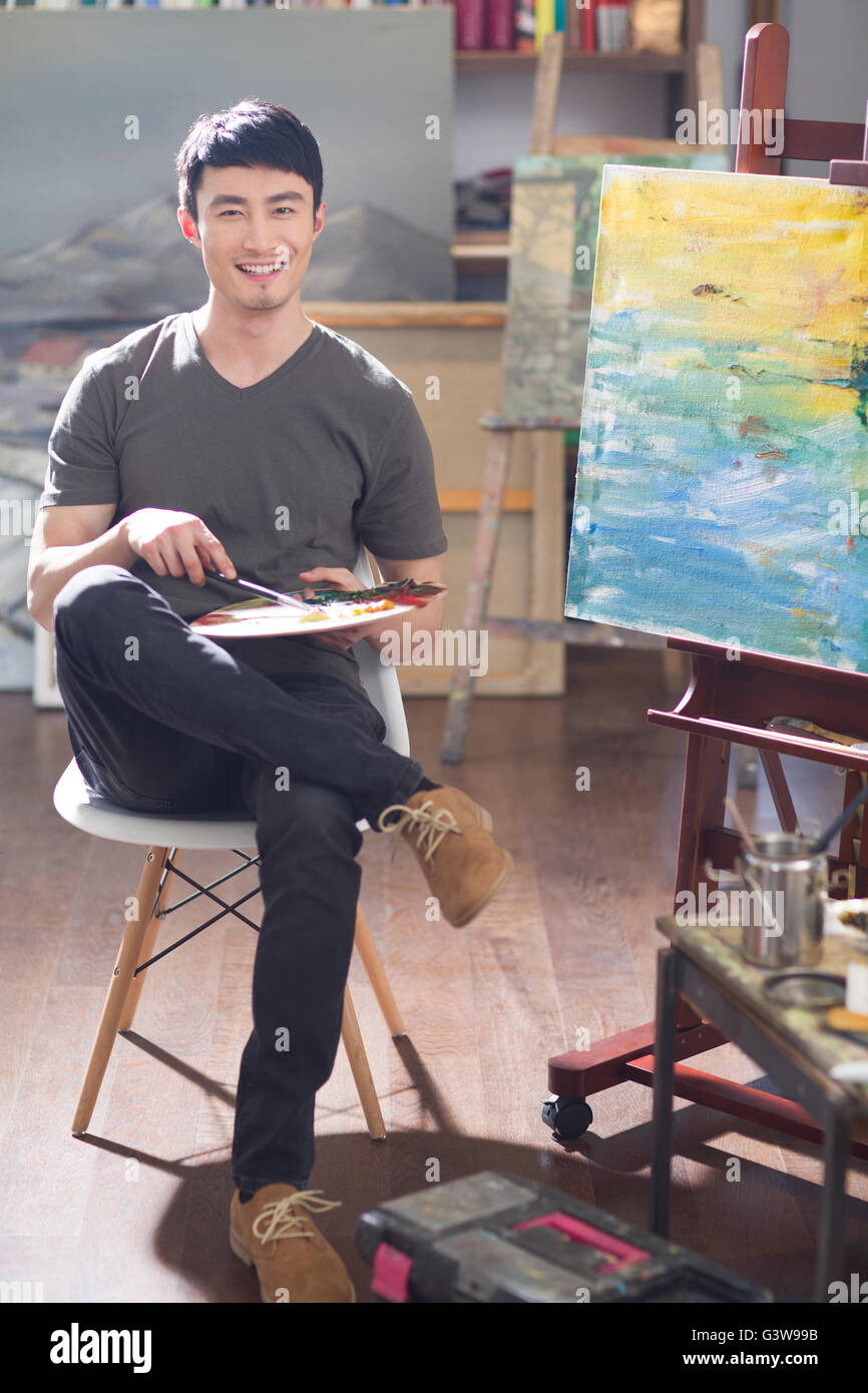 Artist painting in his studio Stock Photo - Alamy