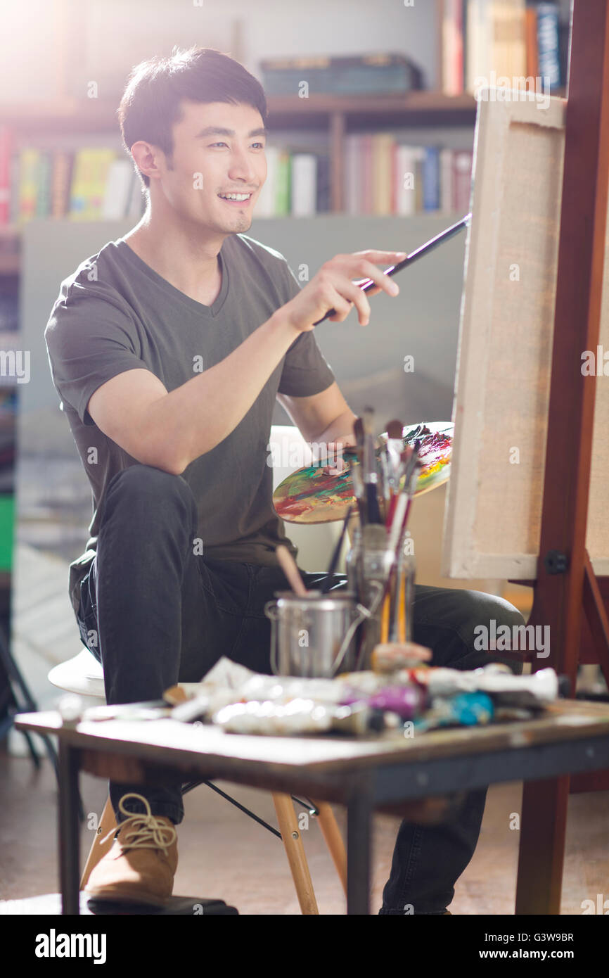 Artist painting in his studio Stock Photo - Alamy