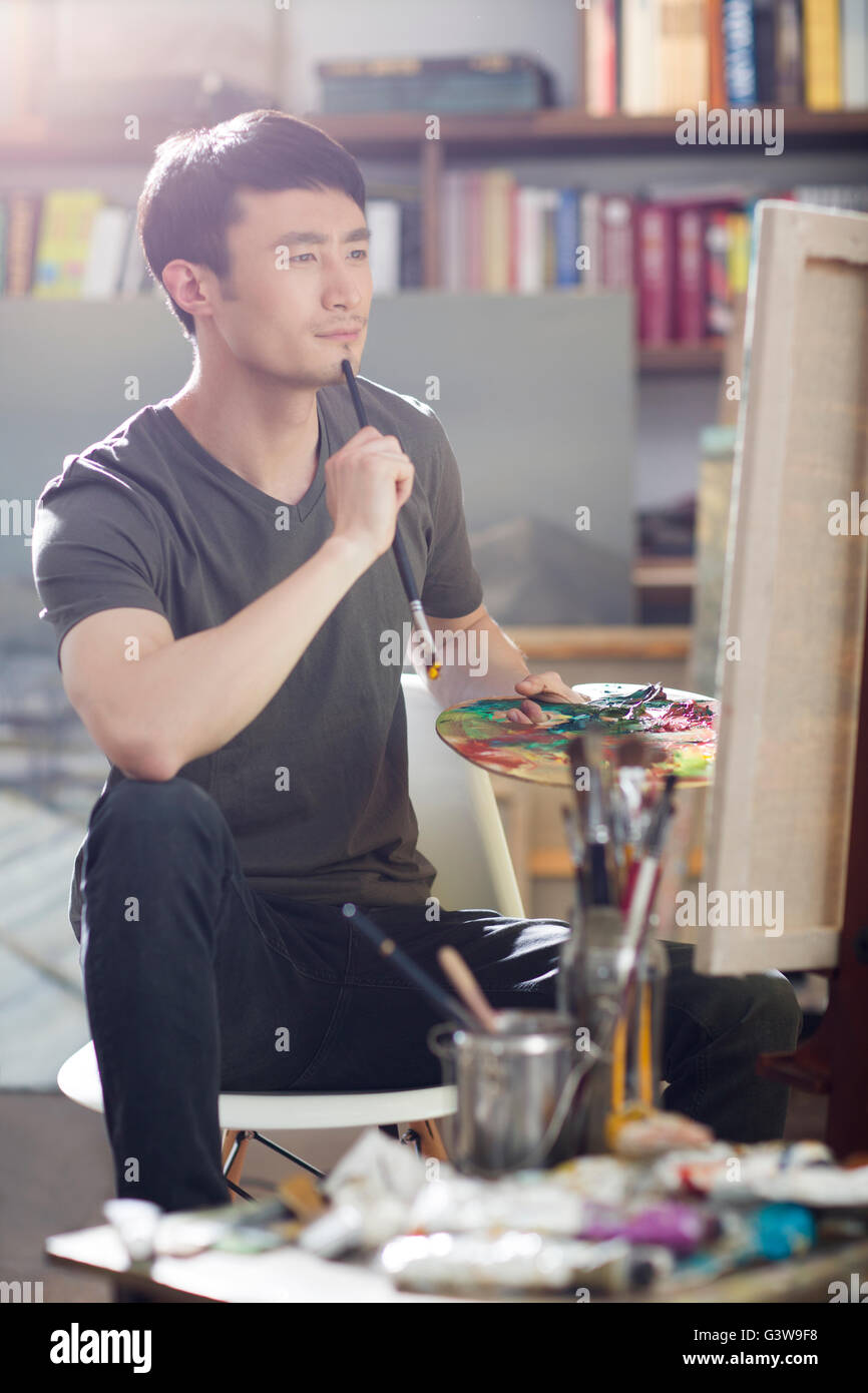 Artist painting in his studio Stock Photo - Alamy