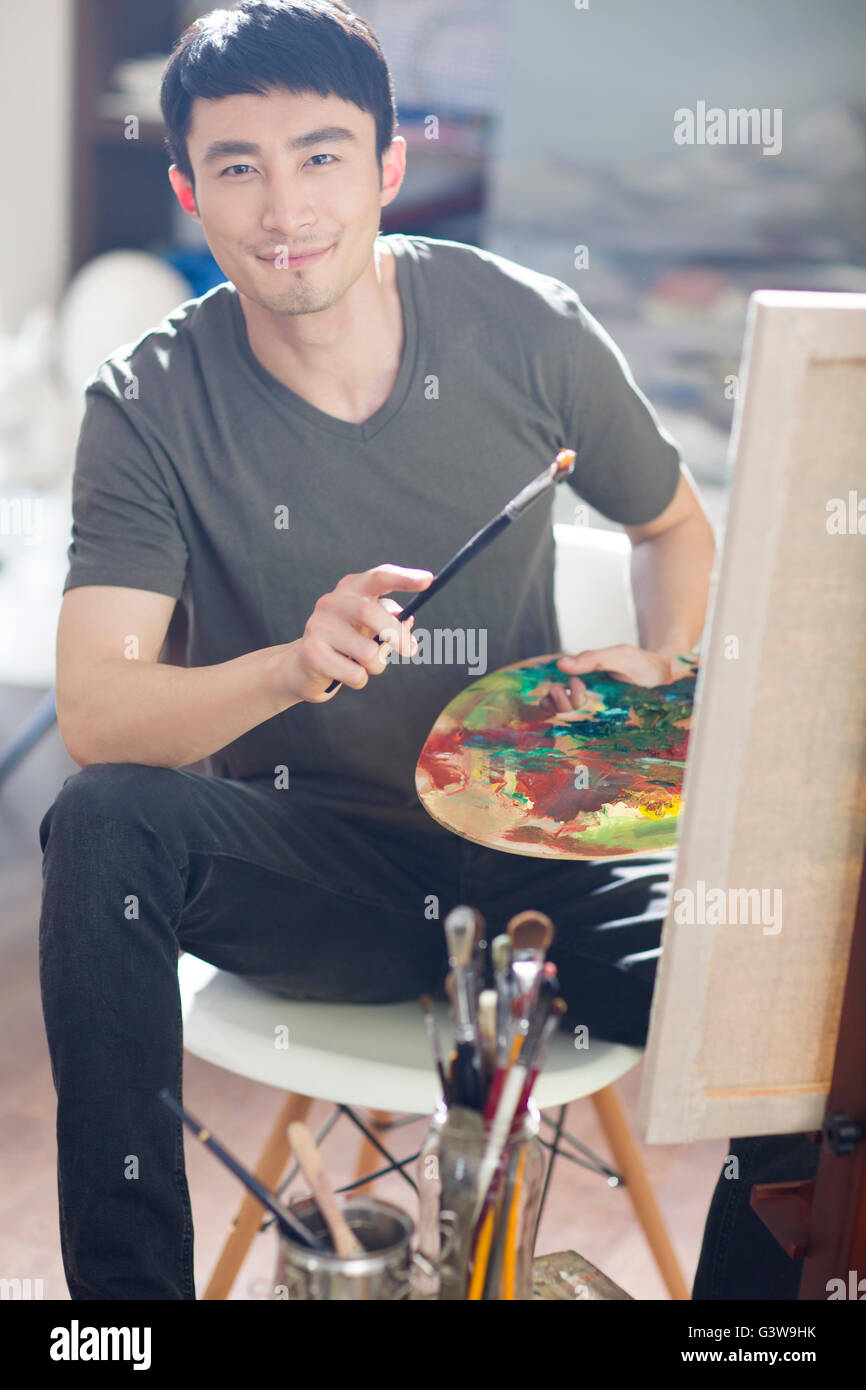 Artist painting in his studio Stock Photo - Alamy