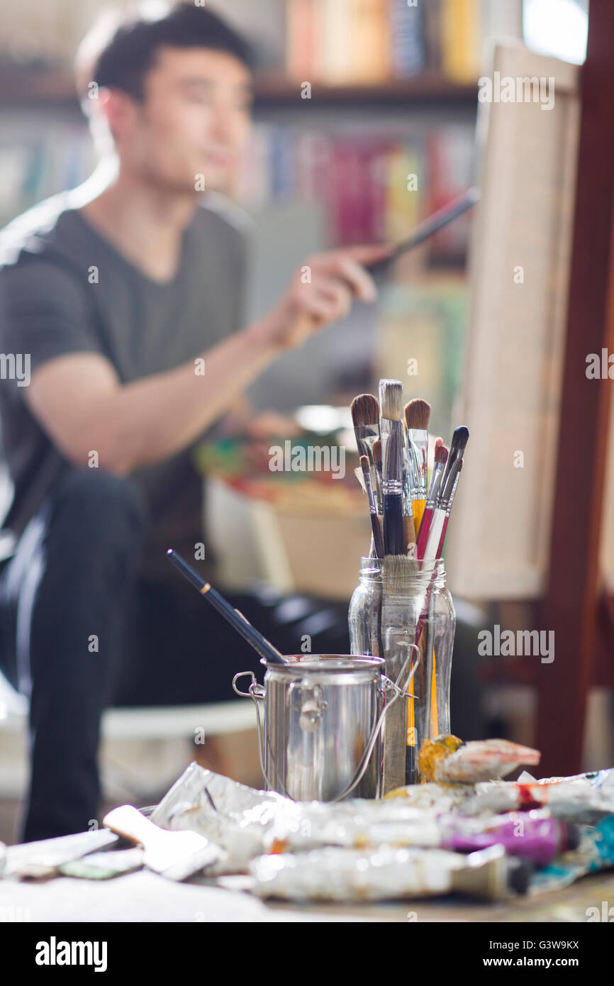 Artist painting in his studio Stock Photo - Alamy