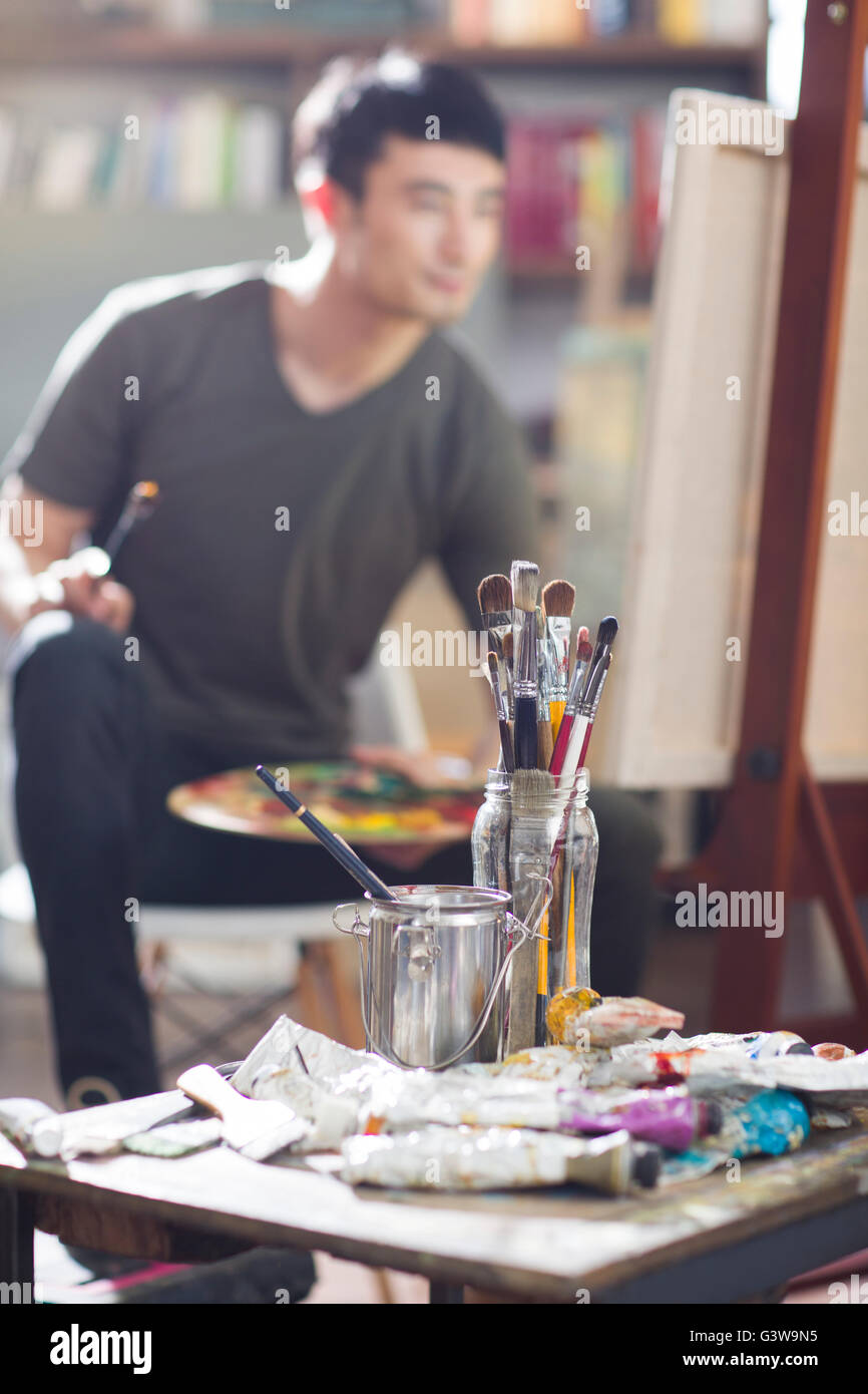 Artist painting in his studio Stock Photo - Alamy
