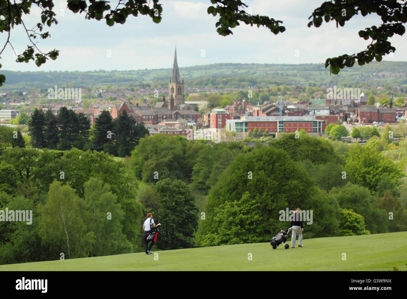 Golfers cross a green on Tapton Park golf course above Chesterfield ...