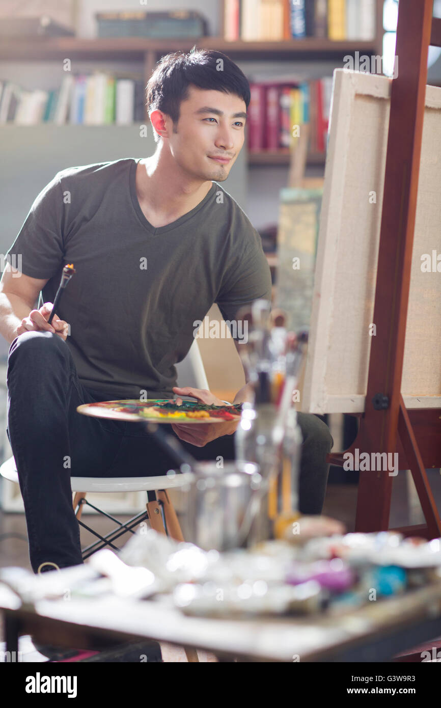 Artist painting in his studio Stock Photo - Alamy