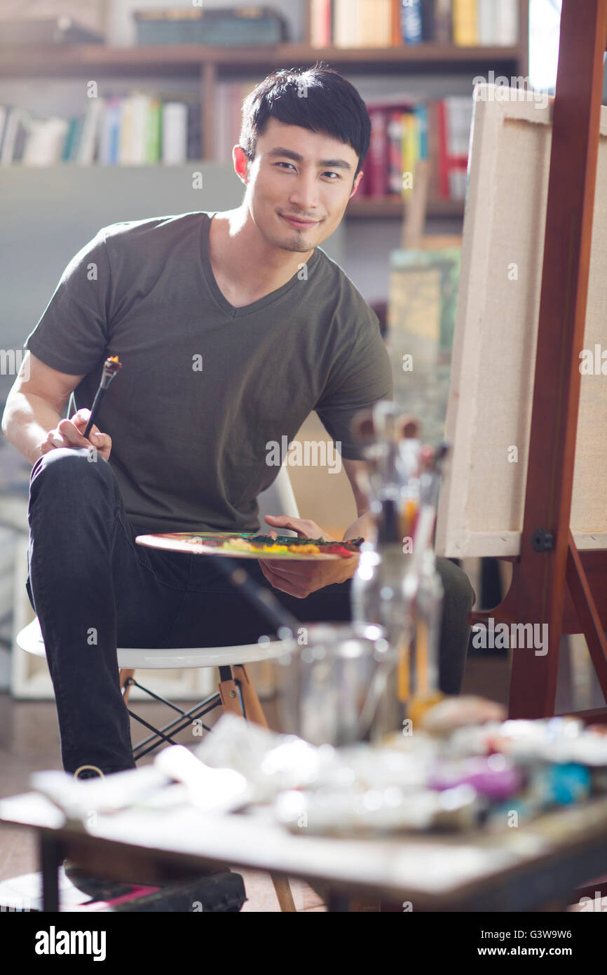 Artist painting in his studio Stock Photo - Alamy