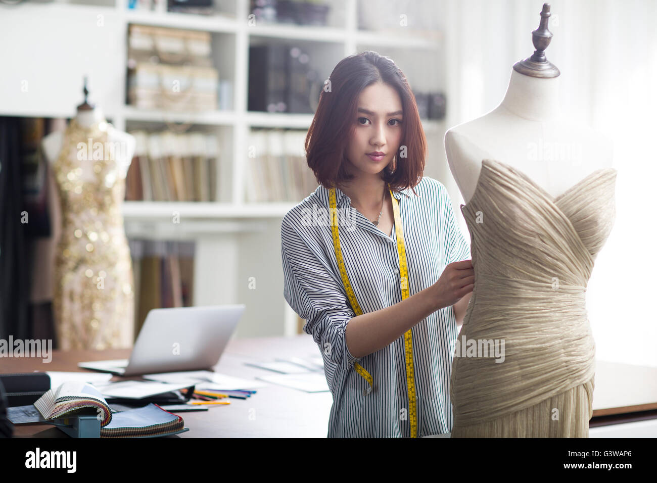 Fashion designer working in studio Stock Photo - Alamy