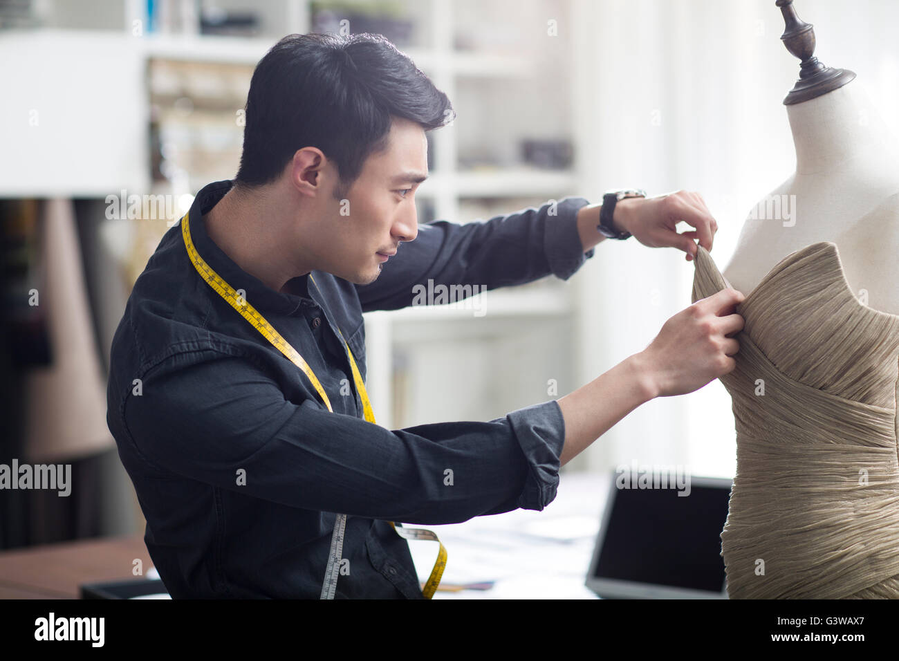 Fashion designer working in studio Stock Photo - Alamy