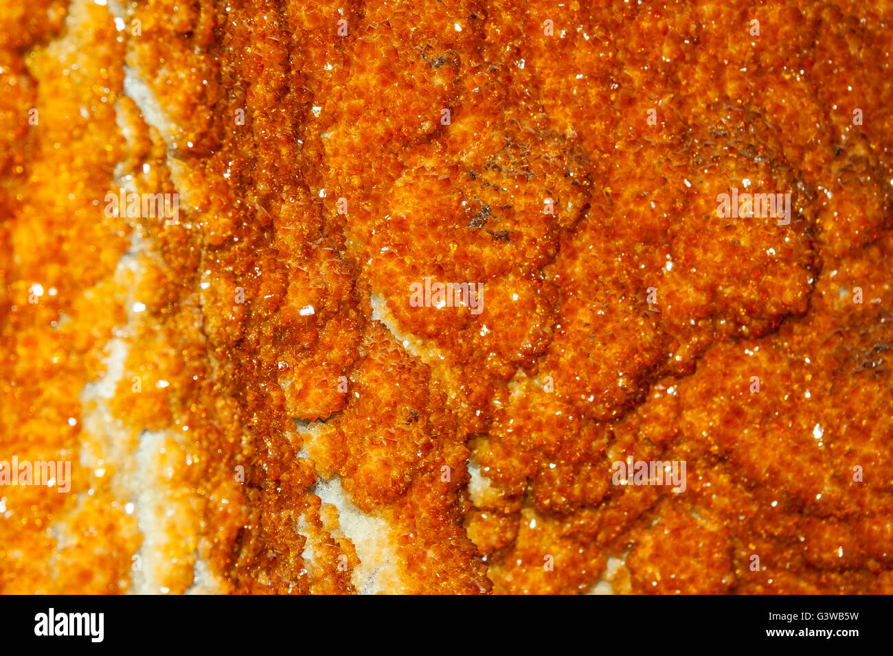 Inside part of geode mineral with orange crystals Stock Photo - Alamy