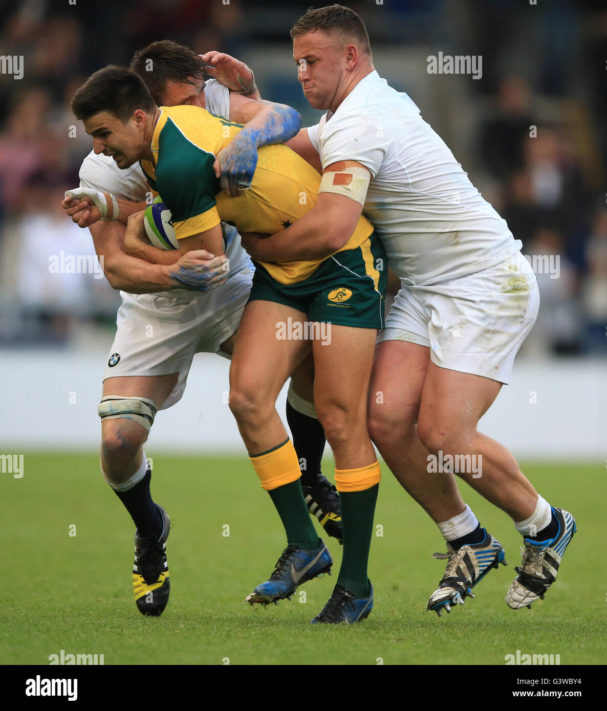 Australia's Jack Maddocks (centre) is tackled by England's Will Stuart ...