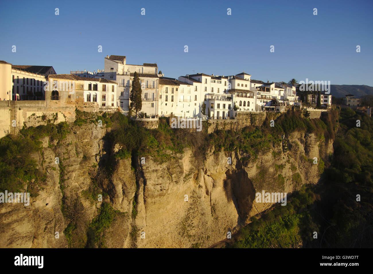 Ronda, view over El Tajo canyon on the old city, evening light ...