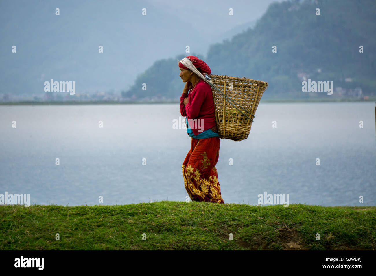 Woman carrying goods hi-res stock photography and images - Alamy
