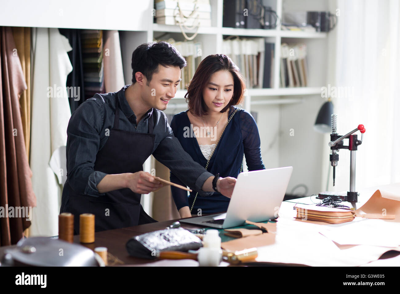 Cheerful craftsman using laptop in hi-res stock photography and images ...