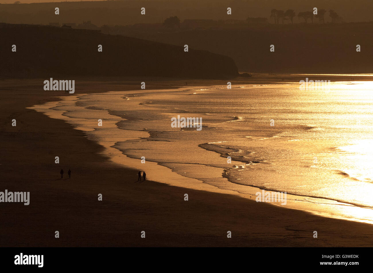 Glistening shimmering sea lit by setting sun Evening Tide Stock Photo ...