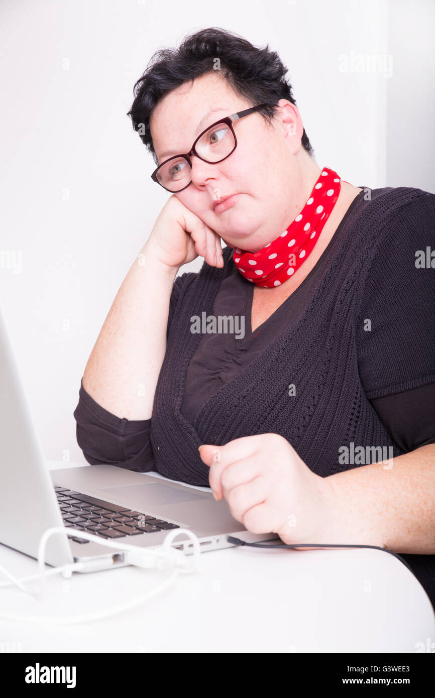 A bored woman in the office Stock Photo - Alamy