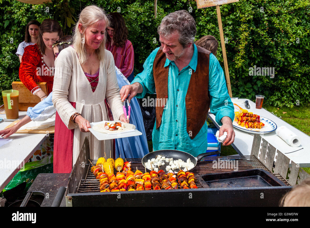 Local People In Costume Cooking Vegetarian Food At The Medieval Fair Of ...