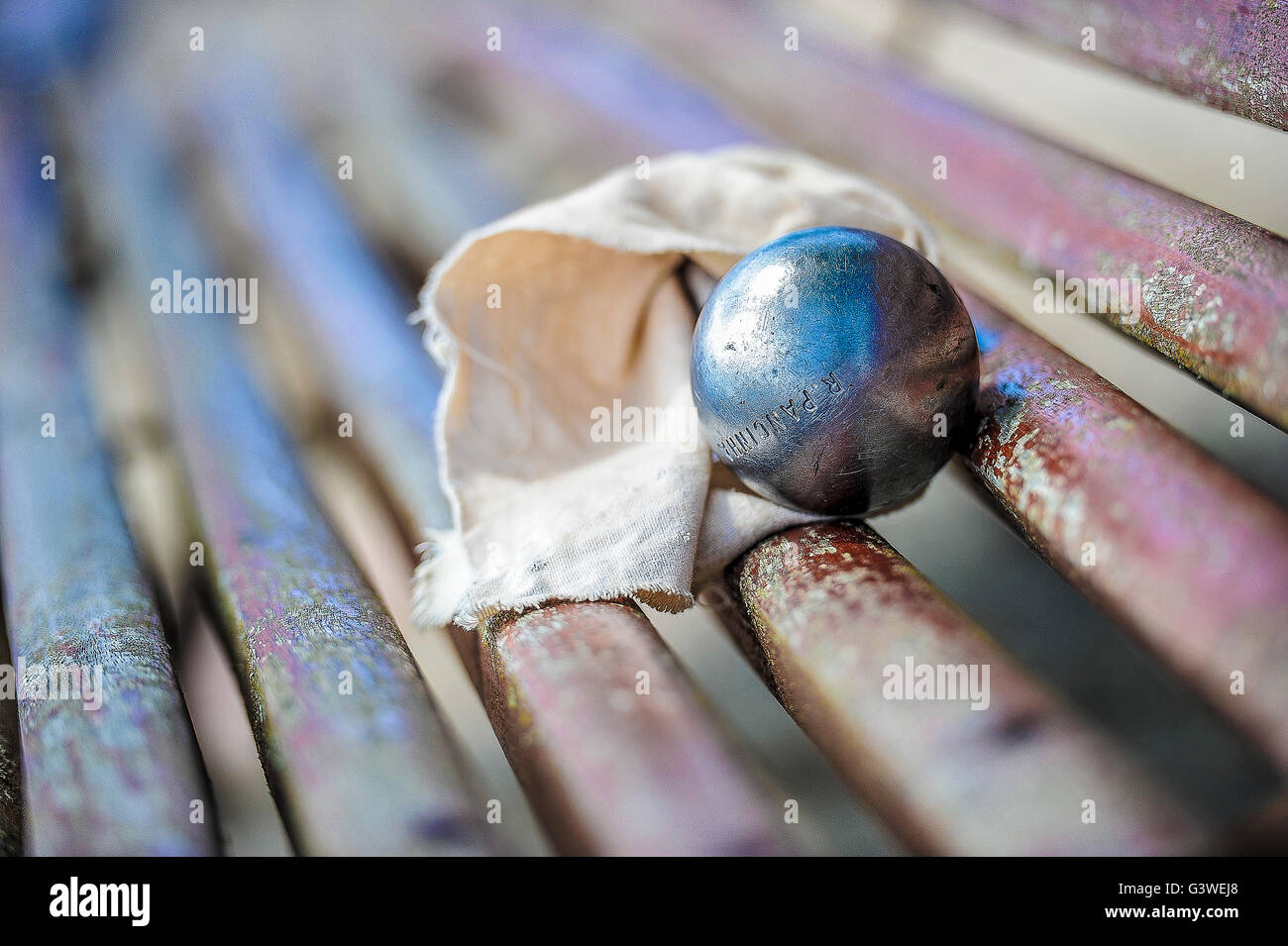 Boule Ball on old vintage bench with polishing cloth Stock Photo - Alamy